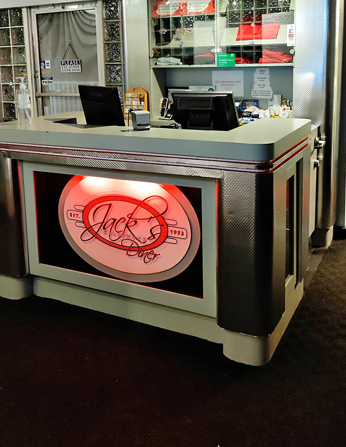 The front counter glows with retro promise. That illuminated Jack's sign isn't just decoration&mdash;it's a beacon of hope for the hungry.