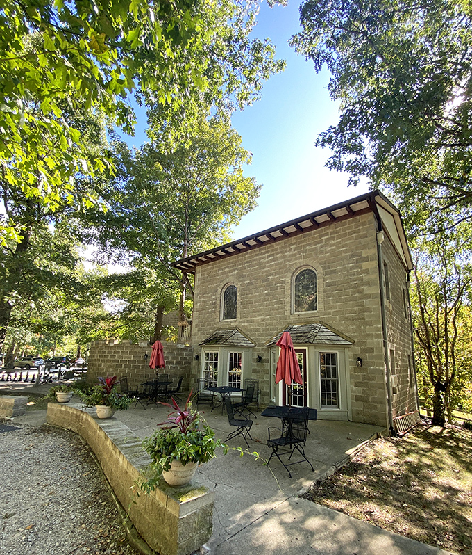 The castle's outdoor dining area offers a perfect spot for a royal feast, complete with red umbrellas fit for any discerning lord or lady.