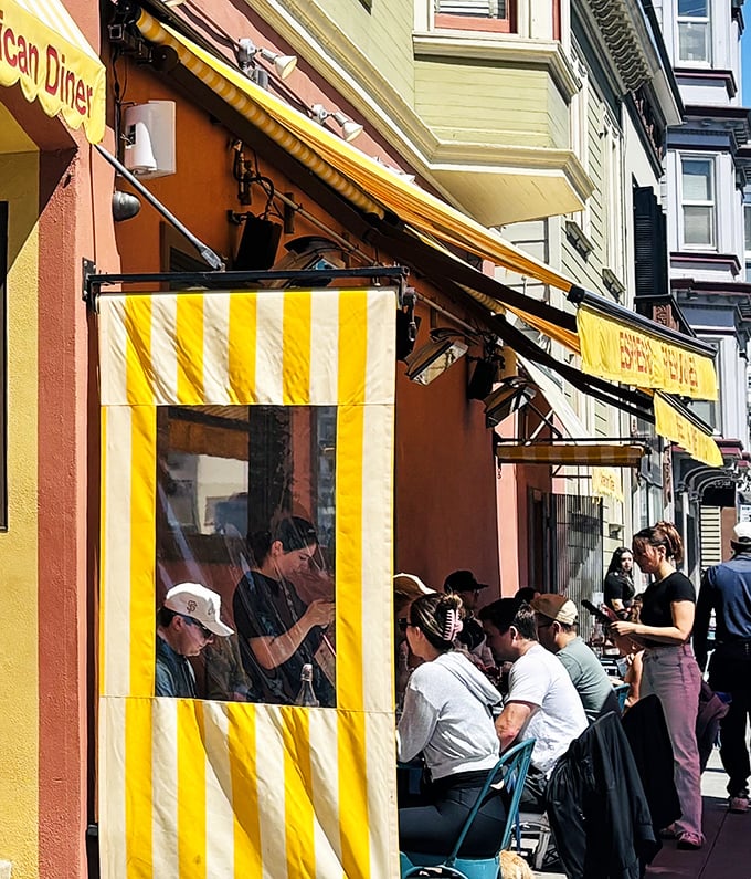 Sidewalk dining where people-watching pairs perfectly with pancakes and the city's morning energy flows freely.