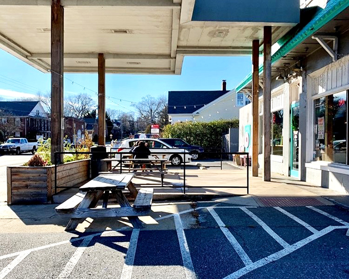 Morning sunshine bathes the picnic area in golden light. The perfect spot to contemplate life's big questions, like "Should I have ordered a dozen instead?"