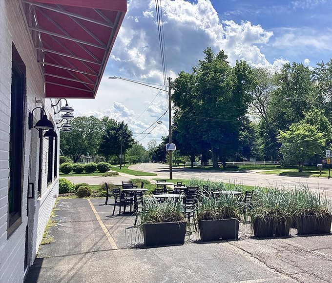 The outdoor seating area offers a peaceful spot to contemplate life's big questions, like "Should I have ordered a second donut?"