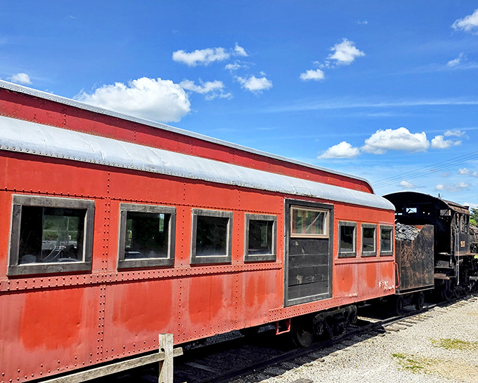 The crimson railcar stands sentinel against blue skies. Even from the outside, you can practically smell the burgers sizzling within.