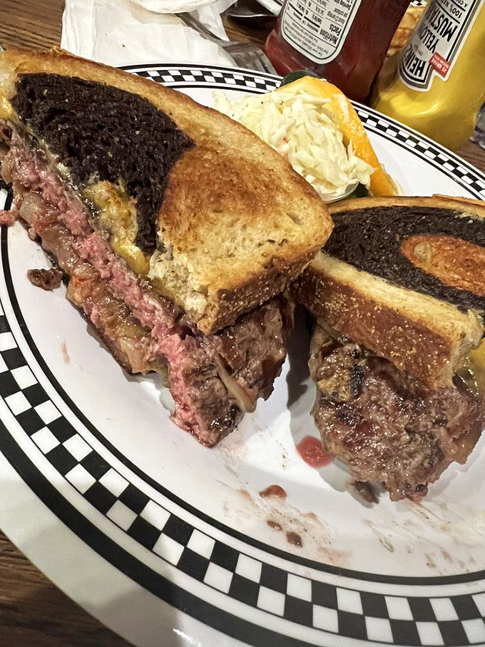 This patty melt isn't just cooked&mdash;it's been sweet-talked into melty, beefy submission between two slices of grilled rye bread. Pure comfort on a plate.