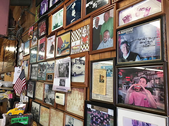 The wall of memories tells stories spanning decades. Photos, clippings, and memorabilia create a community scrapbook that makes first-timers feel like regulars.