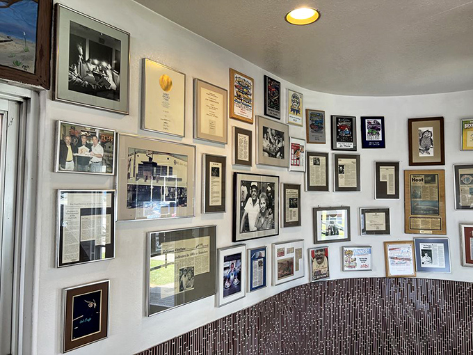 The wall of fame showcases decades of history, newspaper clippings, and famous visitors who've fallen under the Owl's spell.
