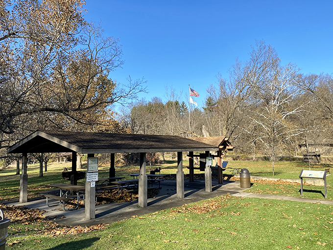 This rustic shelter isn't just a picnic spot&mdash;it's civilization's modest handshake with wilderness, offering just enough comfort.