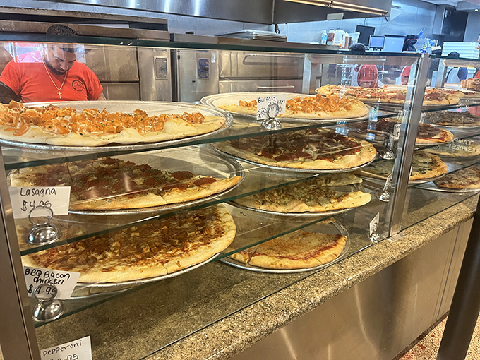 Pizza paradise on display &ndash; each pie patiently waiting its turn to become someone's best decision of the day.