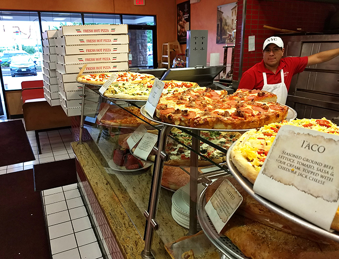 Pizza paradise in plain view&mdash;where dough becomes art and toppings become the painter's palette in this display of circular satisfaction.