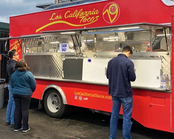 The democratic nature of taco trucks on display—different walks of life, united in the pursuit of hand-held perfection.