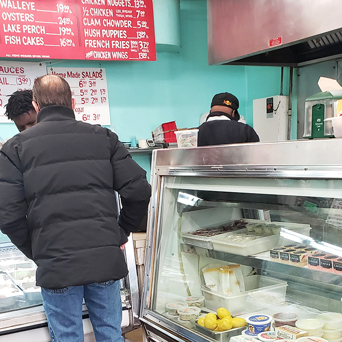 The time-honored ritual of placing an order at The Fish Keg &ndash; where patience is always rewarded with seafood perfection.