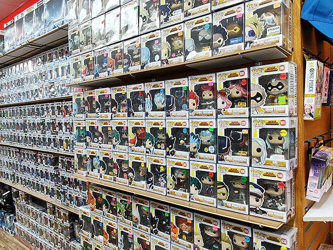 This wall of Pop figurines is where adults can justify toy shopping as "collecting" and where nostalgia comes packaged in perfect little vinyl boxes.