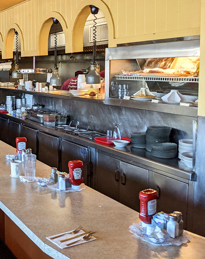The kitchen at Tallyrand&mdash;where breakfast magic happens without pretense. No tweezers or foam in sight, just solid cooking skills.