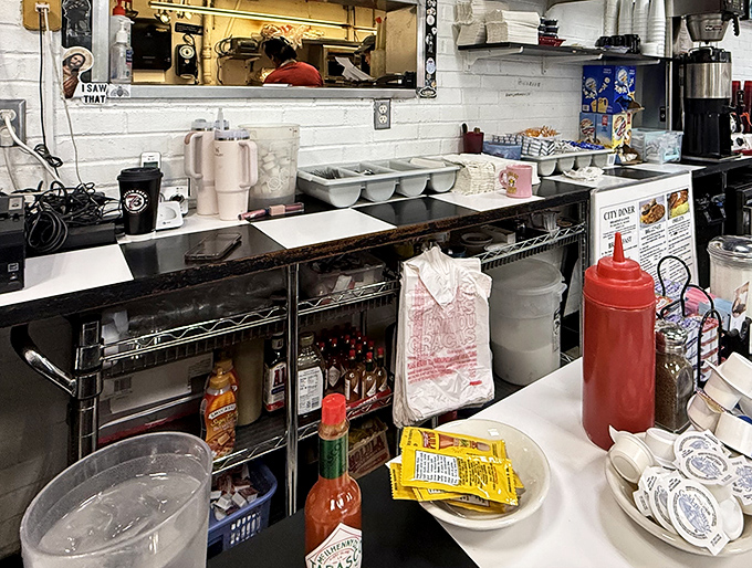 The prep area reveals the beautiful simplicity behind diner magic&mdash;no molecular gastronomy here, just honest cooking tools that have served generations faithfully. 