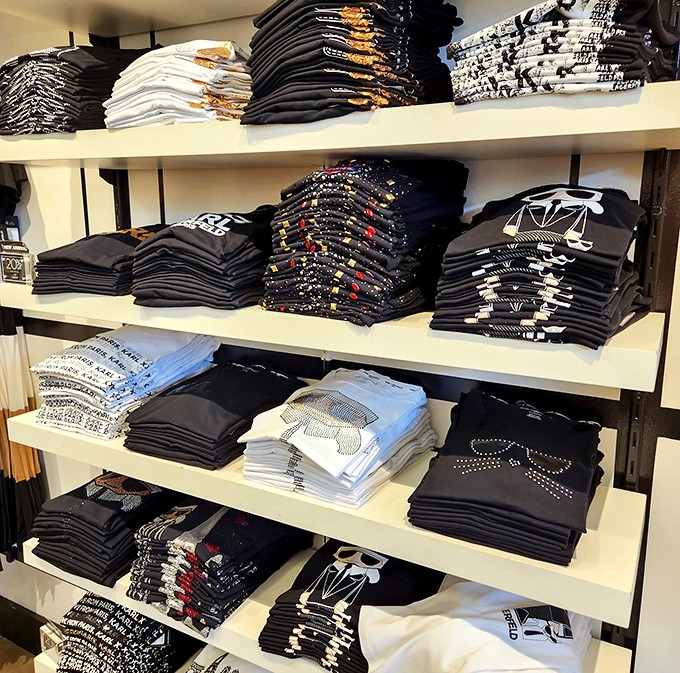 Graphic tees stacked with military precision. Each shirt a conversation starter, personality badge, or evidence in the case against your fashion sense.