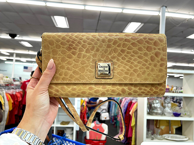 Designer labels hiding in plain sight! This Dooney & Bourke purse represents the thrill of the hunt that keeps thrifters coming back.