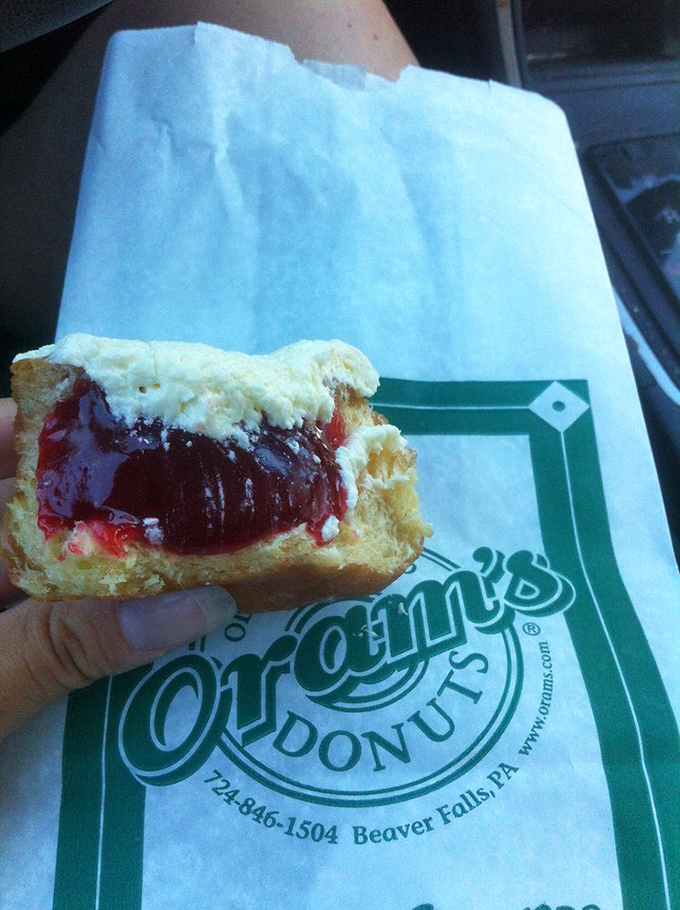 The perfect jelly donut reveals itself – that magical ratio of pillowy dough to tangy filling that makes you forget about "balanced breakfast" entirely.