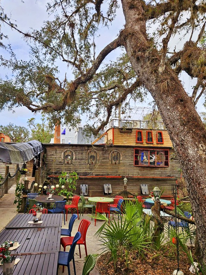 Under the shade of Florida oaks, the restaurant's nautical theme continues with colorful seating that feels both quirky and inviting.