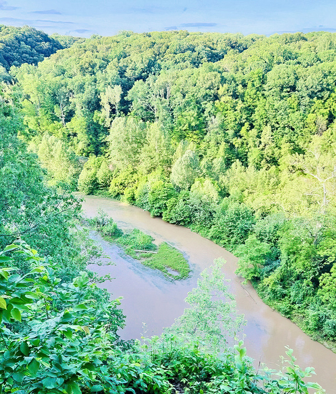 Sugar Creek carves its patient masterpiece through the valley, a reminder that nature's best artwork takes thousands of years.