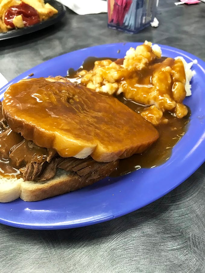 Hot roast beef sandwich swimming in gravy with a side of tater tots&mdash;comfort food that wraps around your soul like a warm blanket on a cold day.
