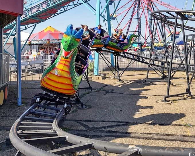 Thrills for the bargain price of courage! This colorful dragon roller coaster offers just enough excitement to make you temporarily forget about that questionable food truck lunch.