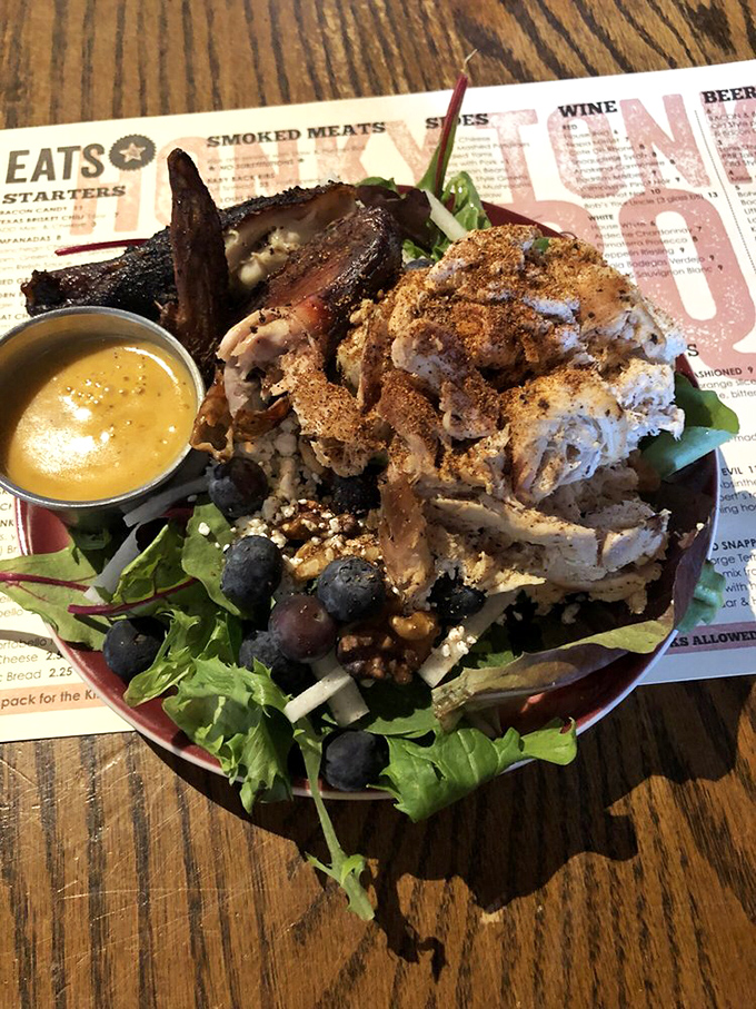 This isn't just a salad &ndash; it's a protein-packed flavor festival where smoky meat and fresh greens find harmony under a drizzle of golden dressing.