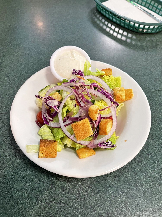 A side salad that actually deserves respect. Crisp, colorful, and proving that sometimes vegetables can sit at the cool table too.