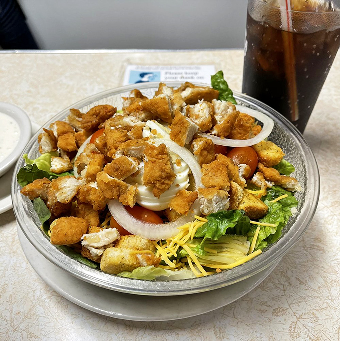 A salad that doesn't apologize for being hearty &ndash; crisp greens playing host to golden chicken and a supporting cast of fresh vegetables.