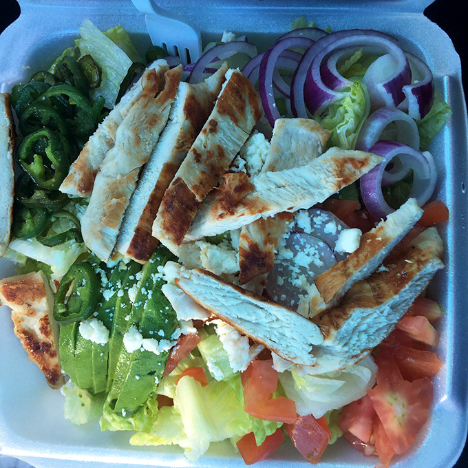 A salad that doesn't apologize for being healthy. Crisp vegetables, grilled chicken, and feta cheese create the perfect counterpoint to pizza indulgence.