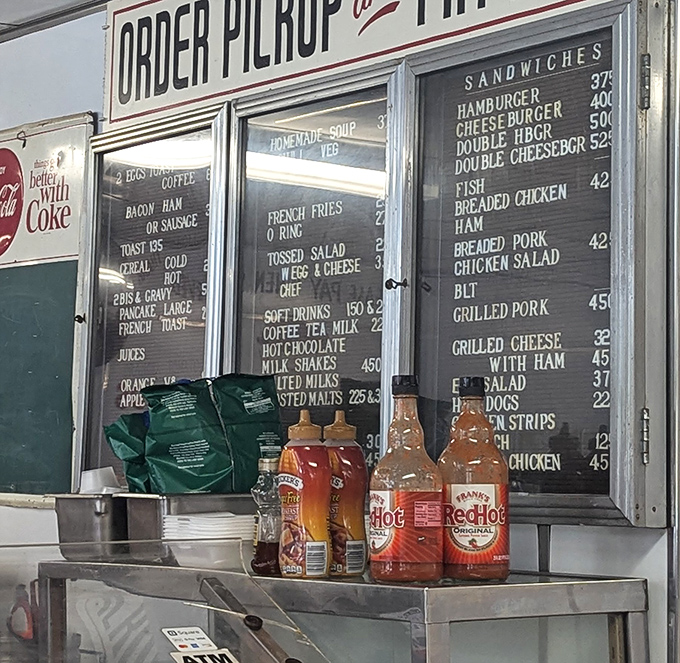 The condiment lineup&mdash;silent heroes of the burger experience. These bottles have seasoned more memories than most family photo albums.