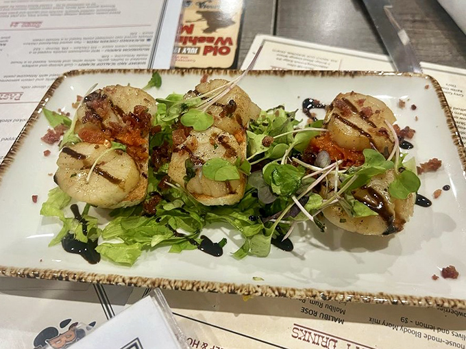 Scallops seared to golden perfection, arranged like edible jewelry. The microgreens add color to what might be the ocean's greatest gift to landlocked Ohio.