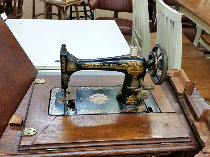 This vintage Singer sewing machine tells stories of garments past, waiting for a new chapter in someone's crafting journey.