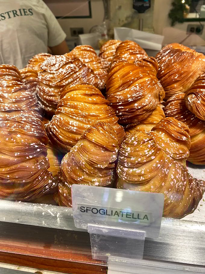 Sfogliatelle with more delicate layers than a Shakespearean drama, each one whispering sweet nothings of butter and sugar.