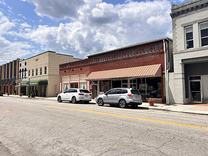 Downtown storefronts maintain their early 20th-century charm, their brick facades housing everything from vintage fishing lures to forgotten vinyl treasures.