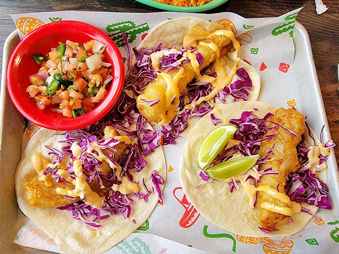 Fish tacos dressed with vibrant purple cabbage and fresh pico de gallo&mdash;a colorful fiesta that's as pleasing to the eyes as it is to the palate.