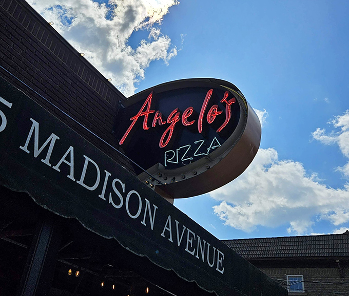 Another angle of that hypnotic neon sign—the kind that has likely photobombed countless "we're about to eat something amazing" selfies.