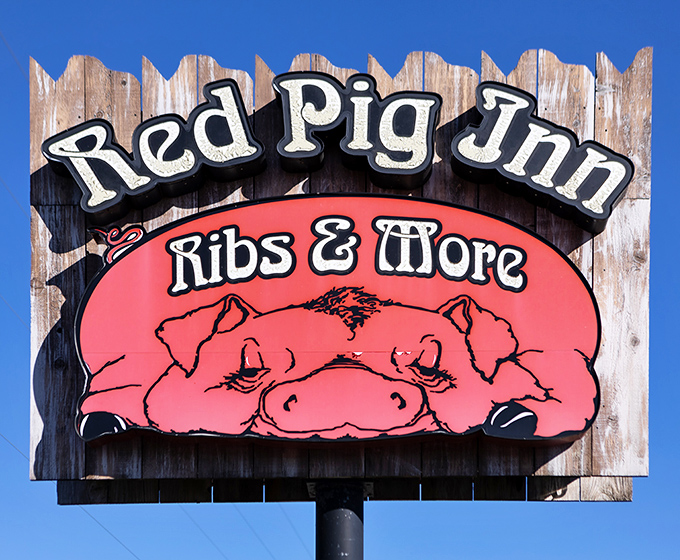 The roadside sign says it all: "Ribs & More." But mostly ribs. That cartoon pig knows what you're coming for, and it's not the salad bar.