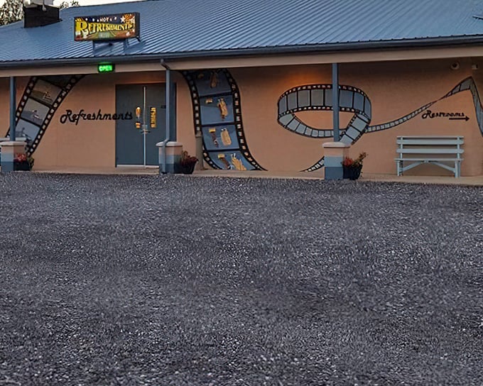 Film strip murals dance across the snack bar walls, celebrating cinema history with artistic flair.