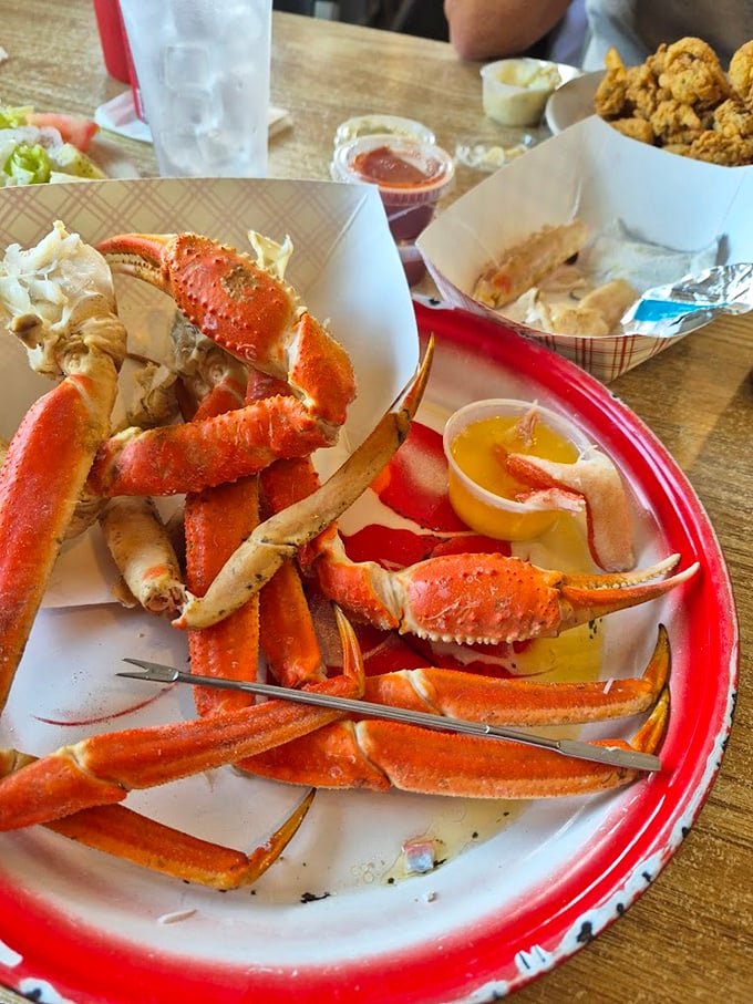 Snow crab legs splayed like a crustacean sunburst&mdash;nature's puzzle box of sweet meat that rewards patience with pure oceanic pleasure.