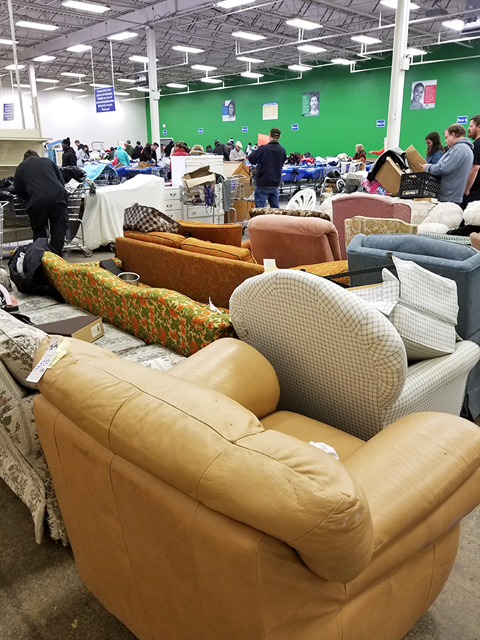 The sofa section &ndash; a living room lineup where mid-century meets country cottage. That orange floral couch has stories to tell.