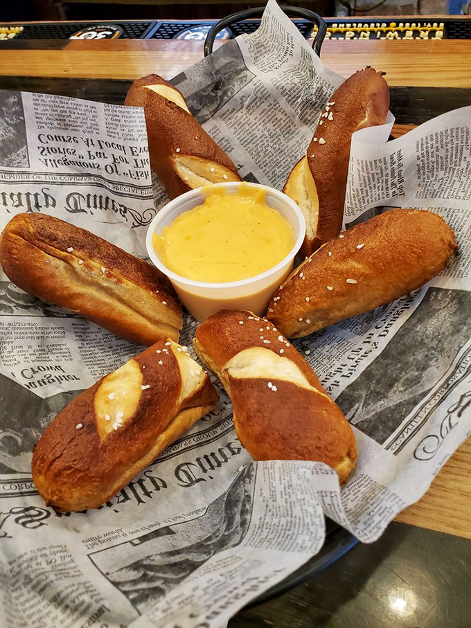 Pretzel perfection with cheese sauce so vibrant it practically glows in the dark—carbs have never looked so tempting.