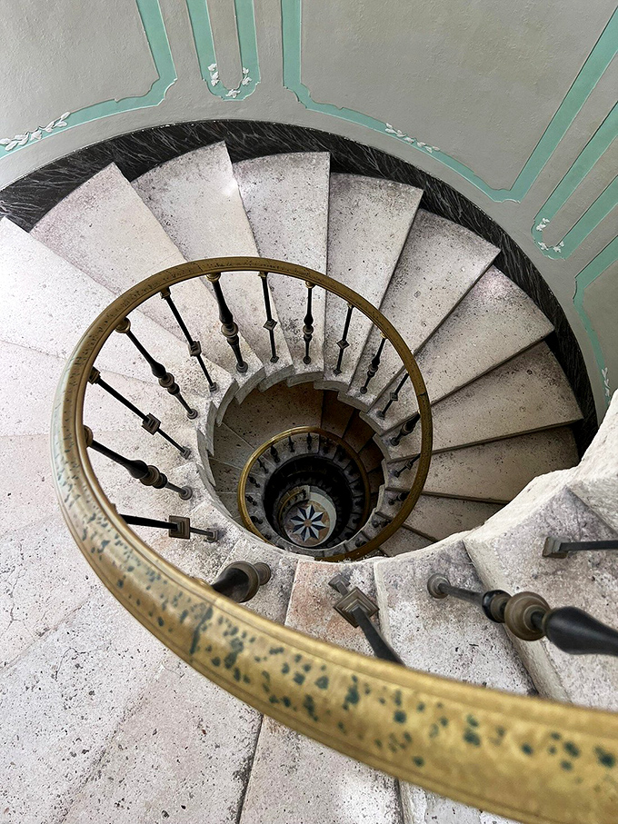 A spiral staircase that makes your daily step count feel like a journey through architectural history. Vertigo never looked so elegant.