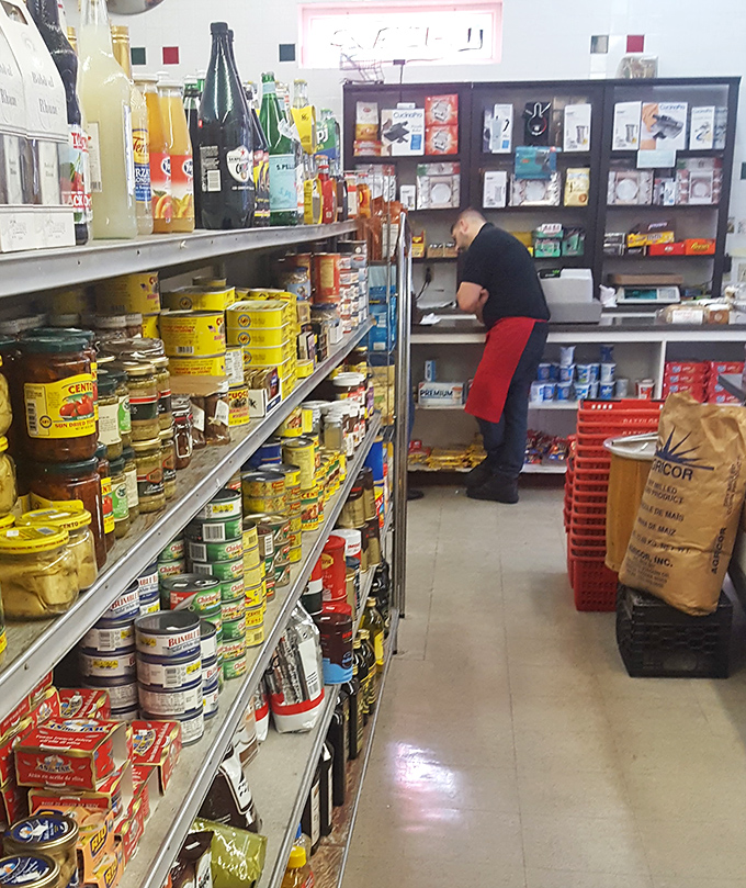 Behind every great deli is a staff that knows the difference between making a sandwich and crafting an experience. The red apron means business.