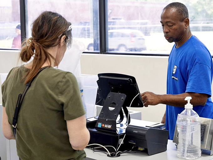 The final transaction, where your treasure hunting pays off. This staff member has seen everything from designer finds to quirky collectibles cross his counter.