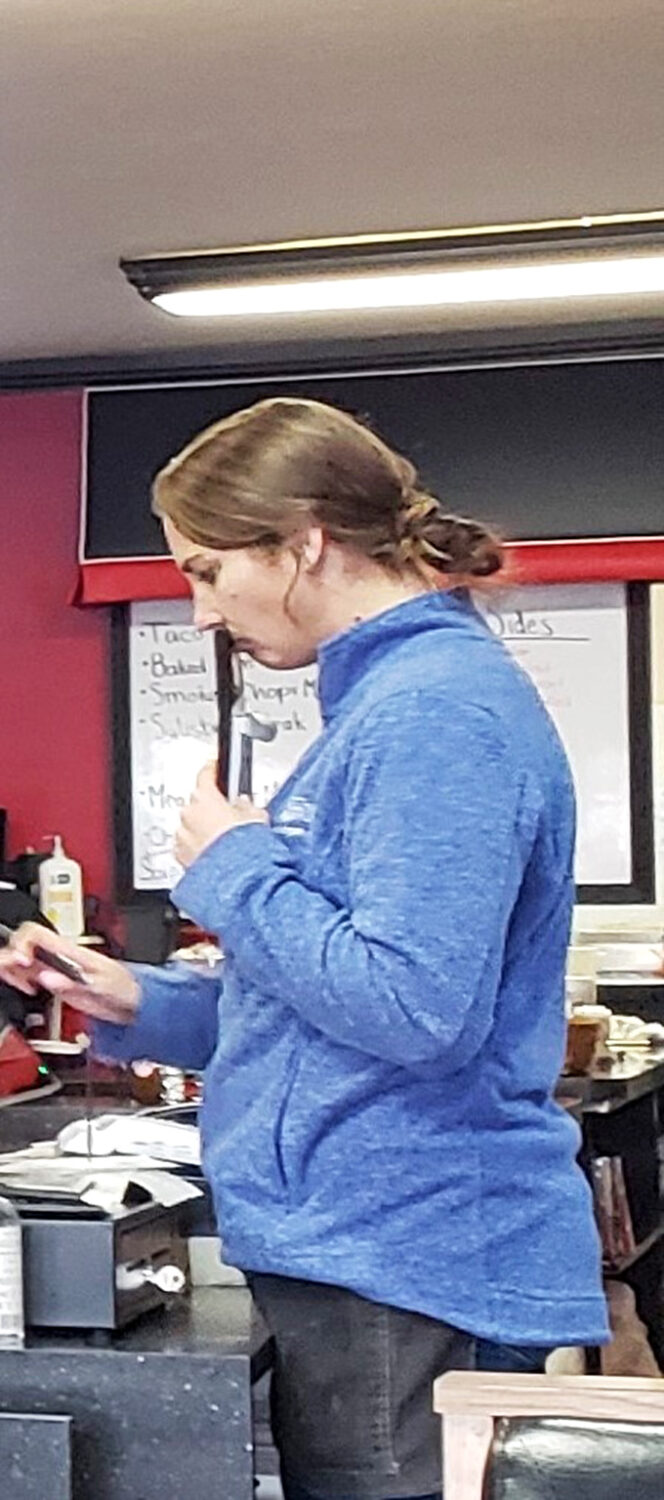 Where the magic happens—kitchen staff focused on crafting the next perfect plate. No celebrity chefs, just dedicated pros.