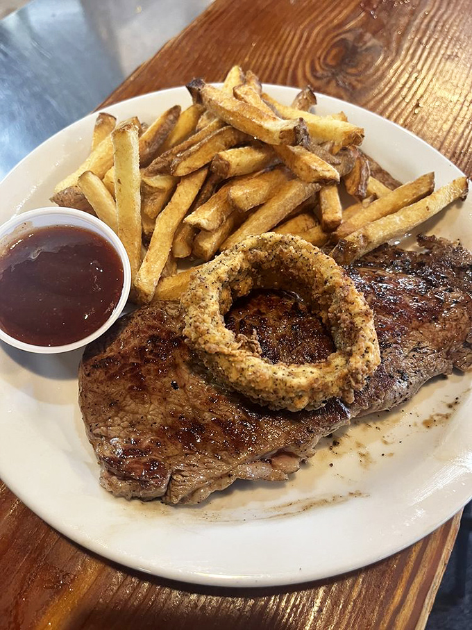 A perfectly cooked steak with one magnificent onion ring&mdash;like Texas itself, straightforward, unpretentious, and absolutely unforgettable.