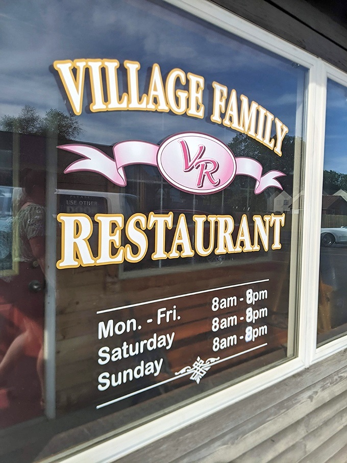 The window sign reveals the restaurant's sensible hours &ndash; because even comfort food perfectionists need time to recharge their culinary batteries.