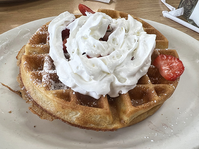 A Belgian waffle crowned with whipped cream and strawberries&mdash;the breakfast equivalent of wearing a tuxedo t-shirt. Fancy, but still knows how to party.