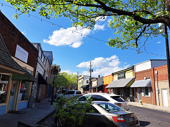 String lights hover above these storefronts like stars that decided the view from heaven wasn't quite as interesting as Olde Town Conyers. 