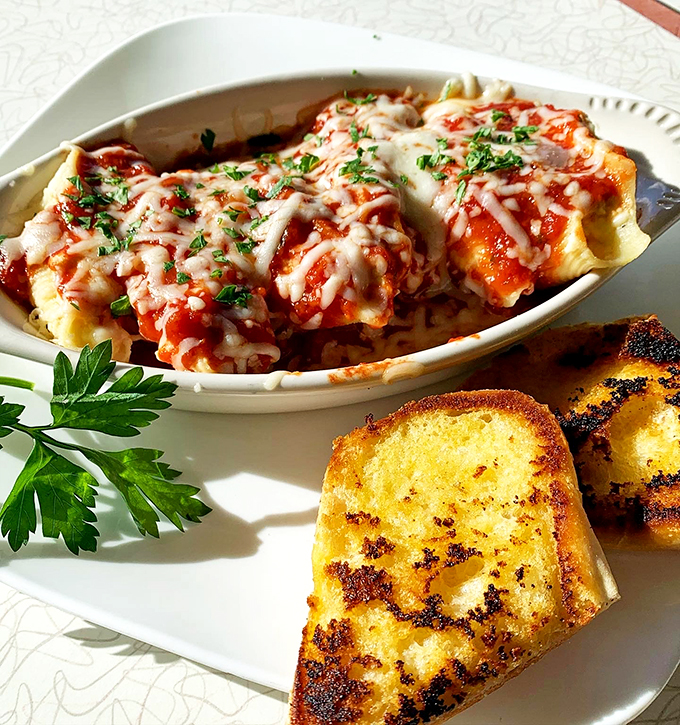 Not your grandmother's manicotti (unless your grandmother was a culinary genius). That melted cheese pull would make Instagram influencers weep with joy.