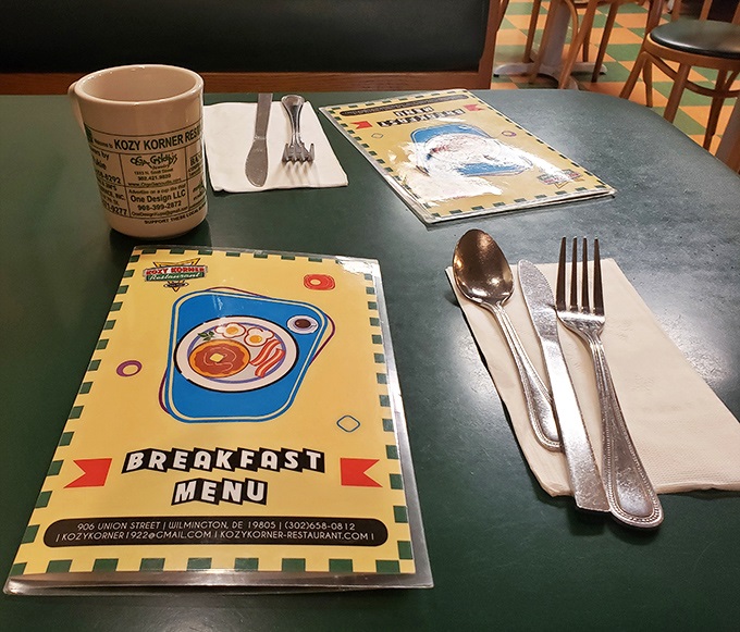 Every great breakfast story begins with a simple table setting &ndash; coffee mug, silverware, and menus promising delicious possibilities.